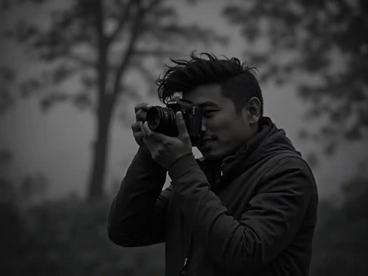 Blurry and Dark Image of a Cameraman Capturing Moment